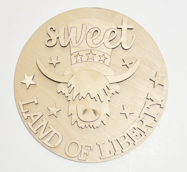 Sweet Land of Liberty Cow Round Doorhanger – Sawdust & Swirls